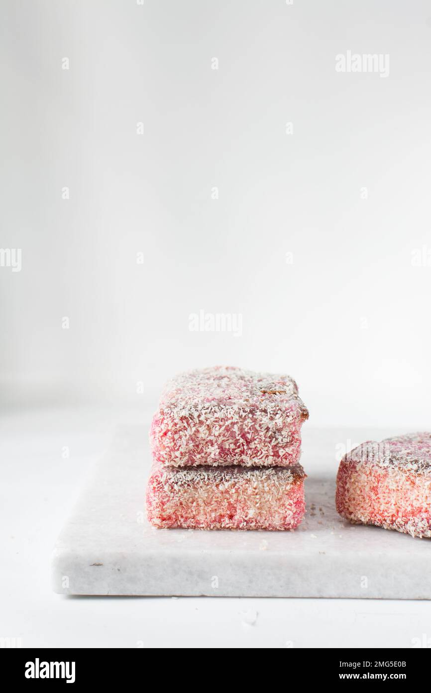 Pink lamingtons on a marble tray, Australian raspberry lamingtons, cake ...