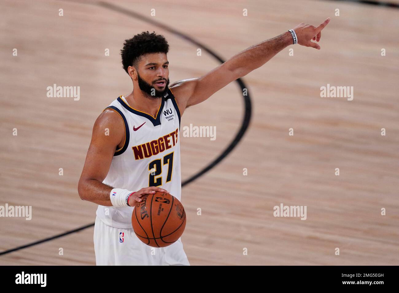 Denver Nuggets' Jamal Murray (27) gestures in the first half of an NBA ...