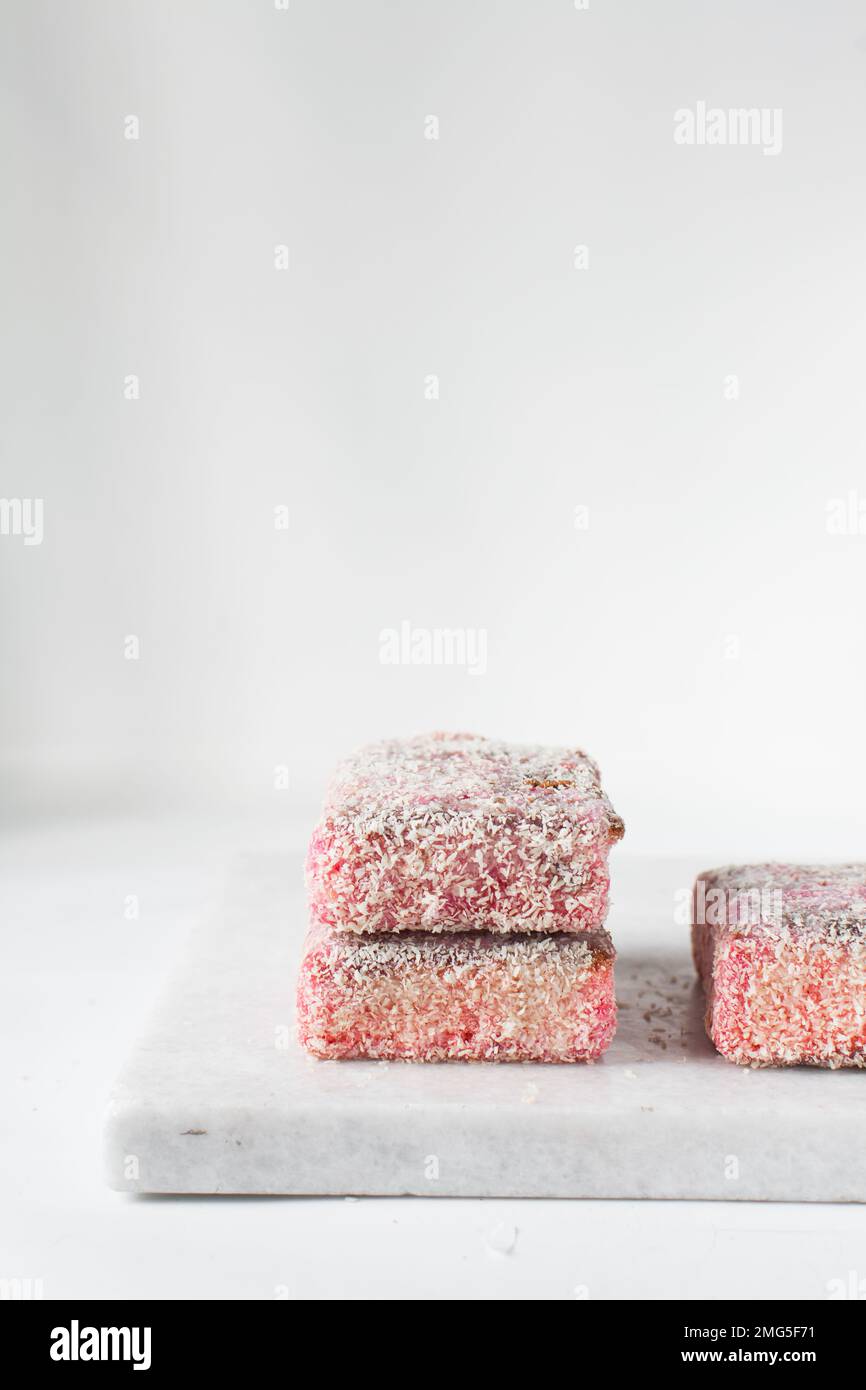Pink lamingtons on a marble tray, Australian raspberry lamingtons, cake ...