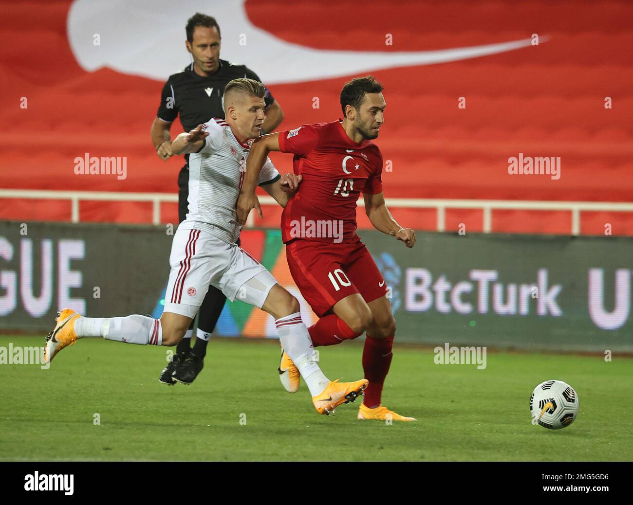 CAPTION CORRECTS DATE Turkey's Hakan Calhanoglu, right, is challenged ...