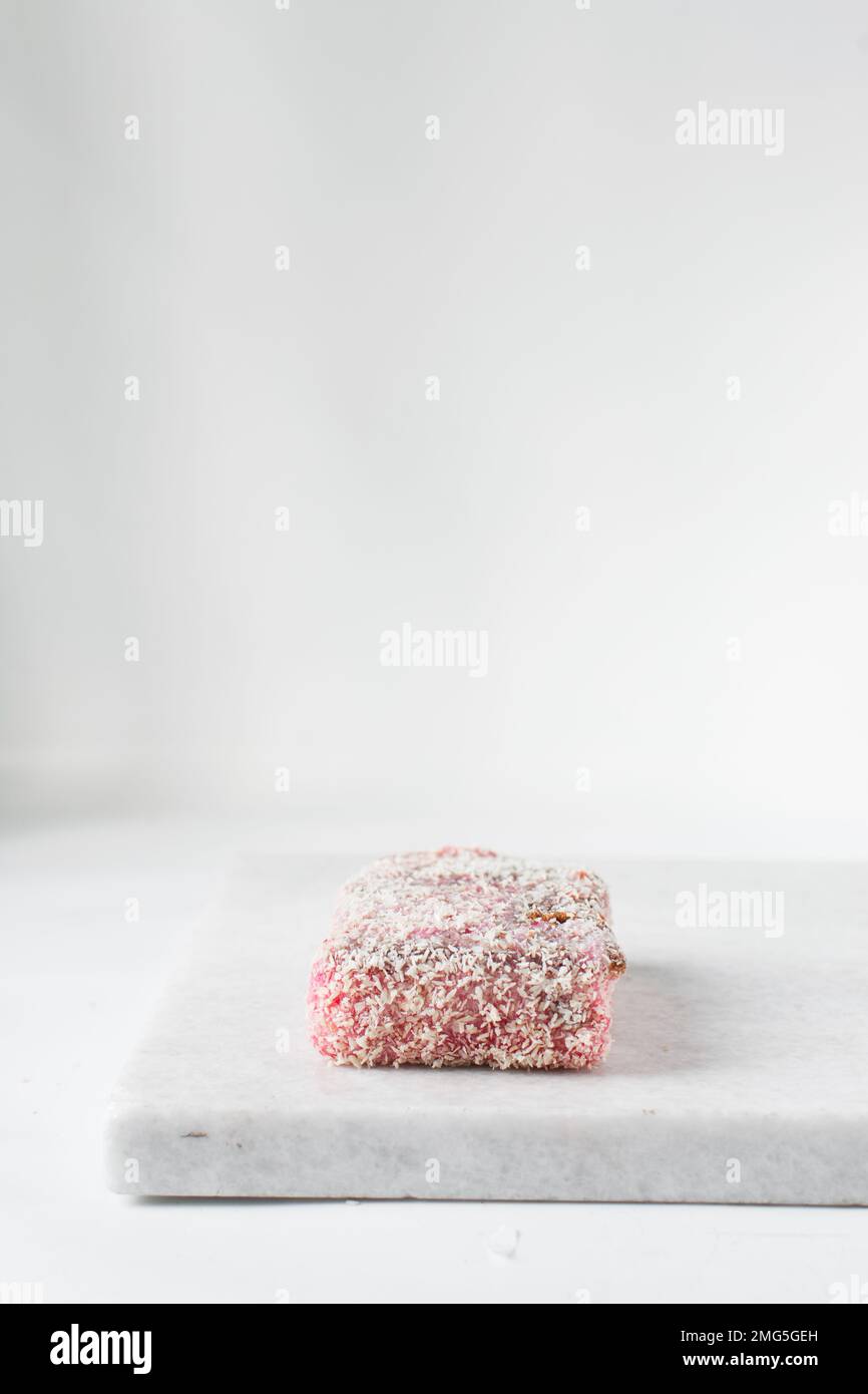Pink lamingtons on a marble tray, Australian raspberry lamingtons, cake ...