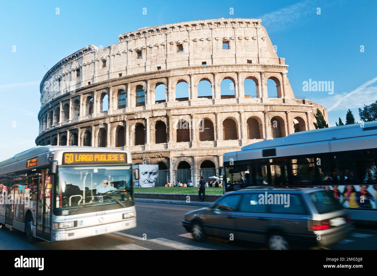 Traffic passing in front of the Colosseum in Rome Italy Stock Photo - Alamy