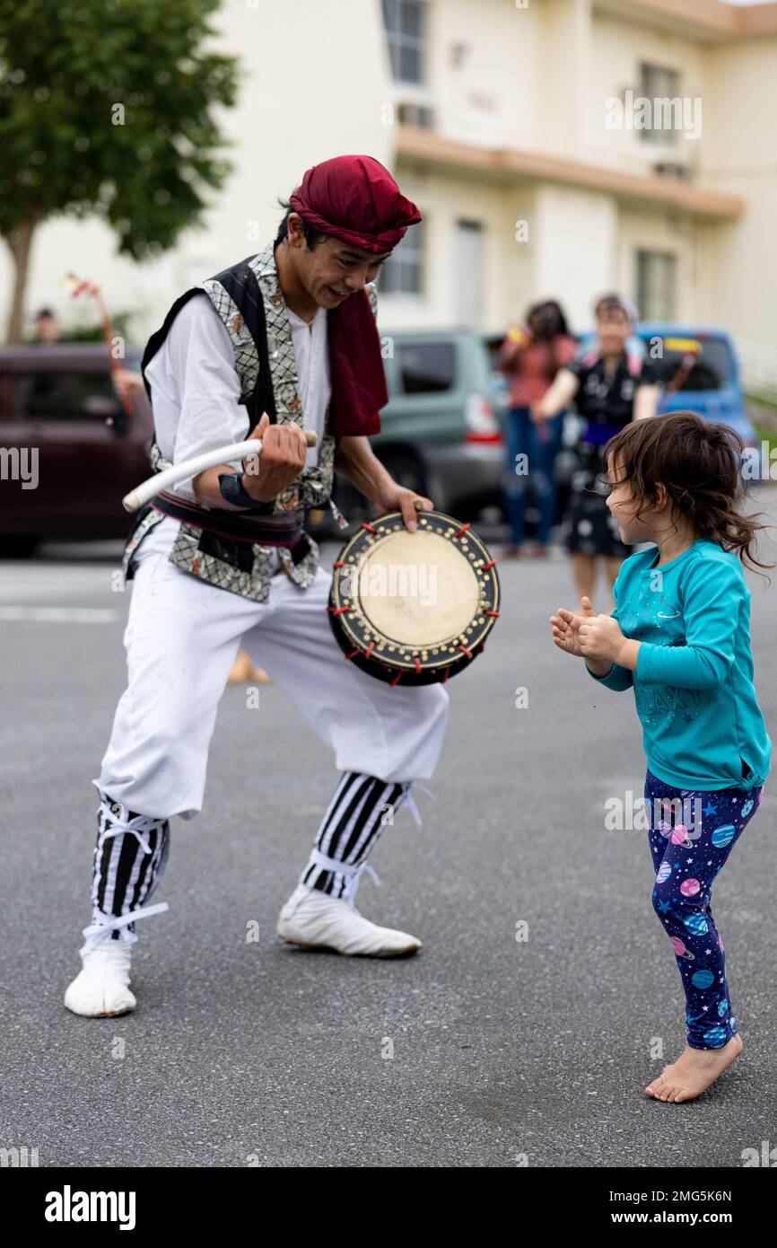 A Shime-daiko drummer, left, with Jaagaru Eisa Group interacts with a ...