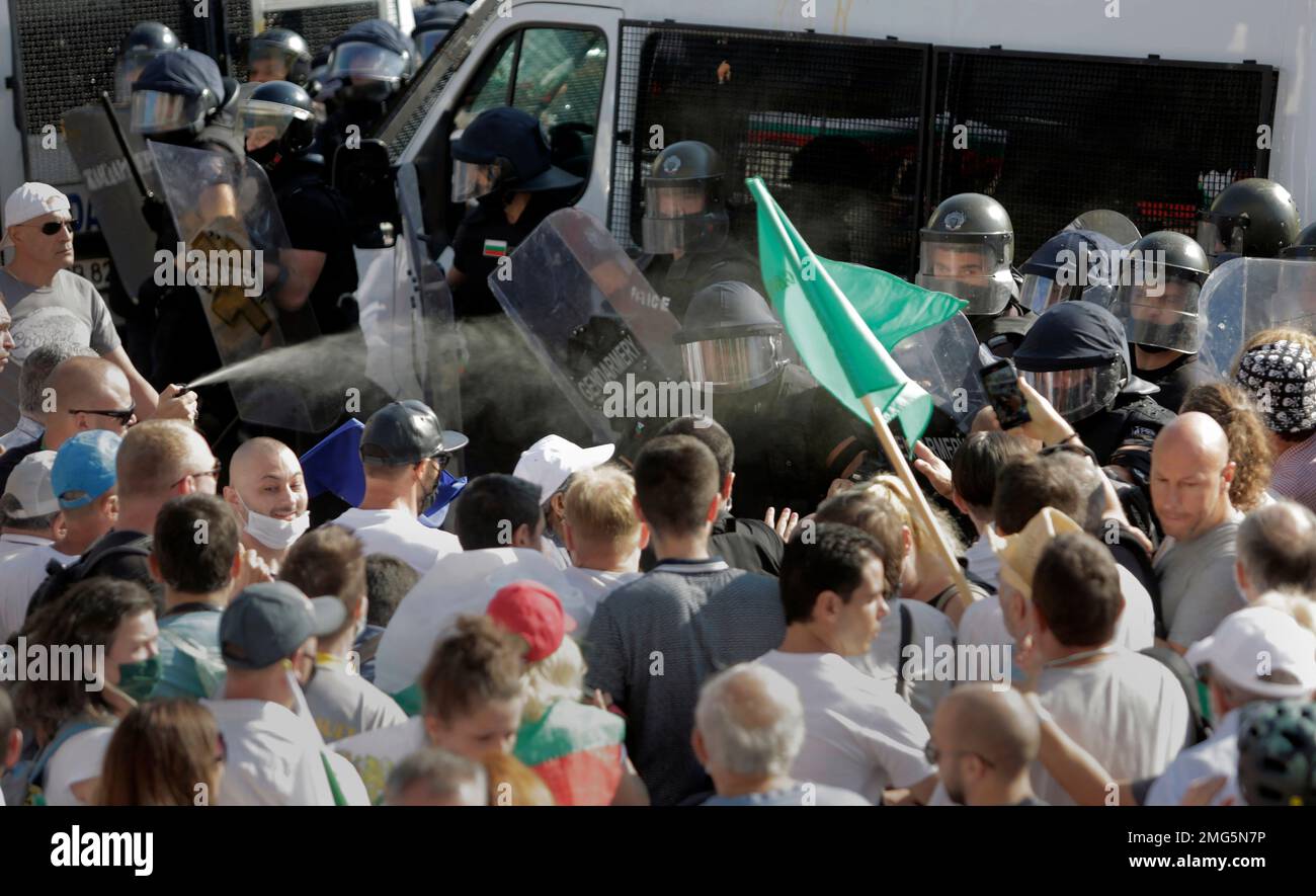 Protesters spray tear gas towards policemen during rally in front of ...