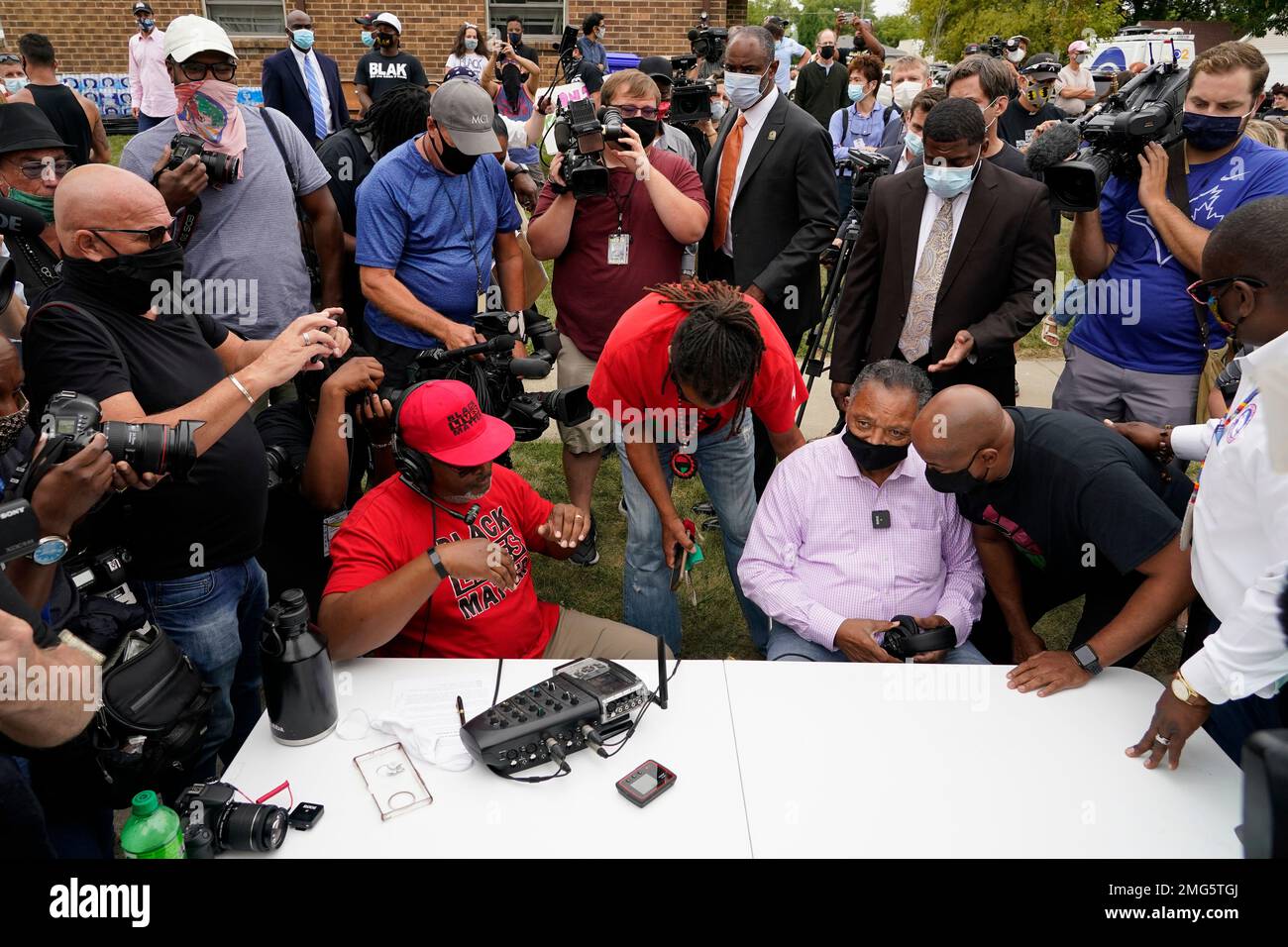 The Rev. Jesse Jackson is interviewed during a community gathering at ...
