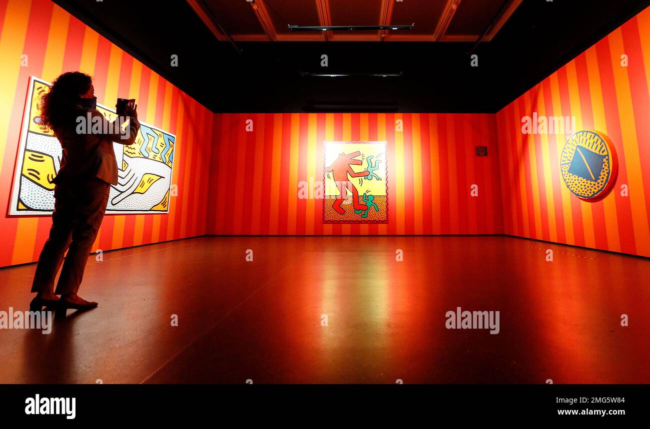 Visitors watching artwork by US artist Keith Haring during an ...
