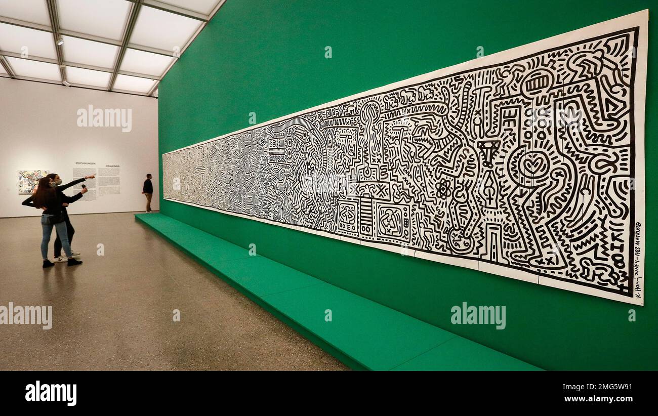 Visitors watching artwork by US artist Keith Haring during an ...