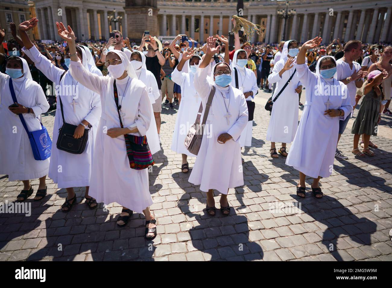 Nuns wave to Pope Francis as he recites the Angelus noon prayer from ...