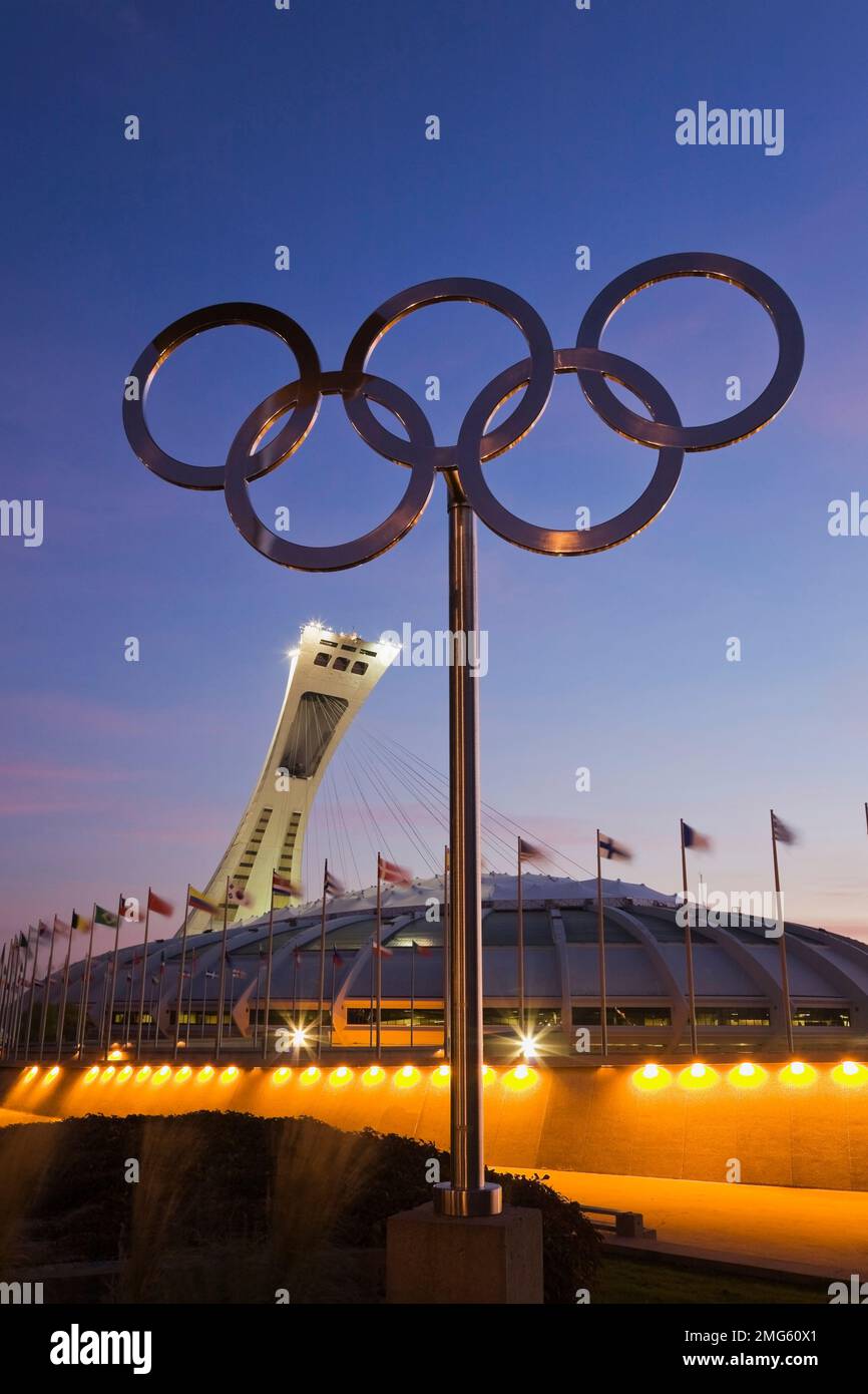 Metal olympic rings sculpture and Olympic Stadium with inclined tower ...