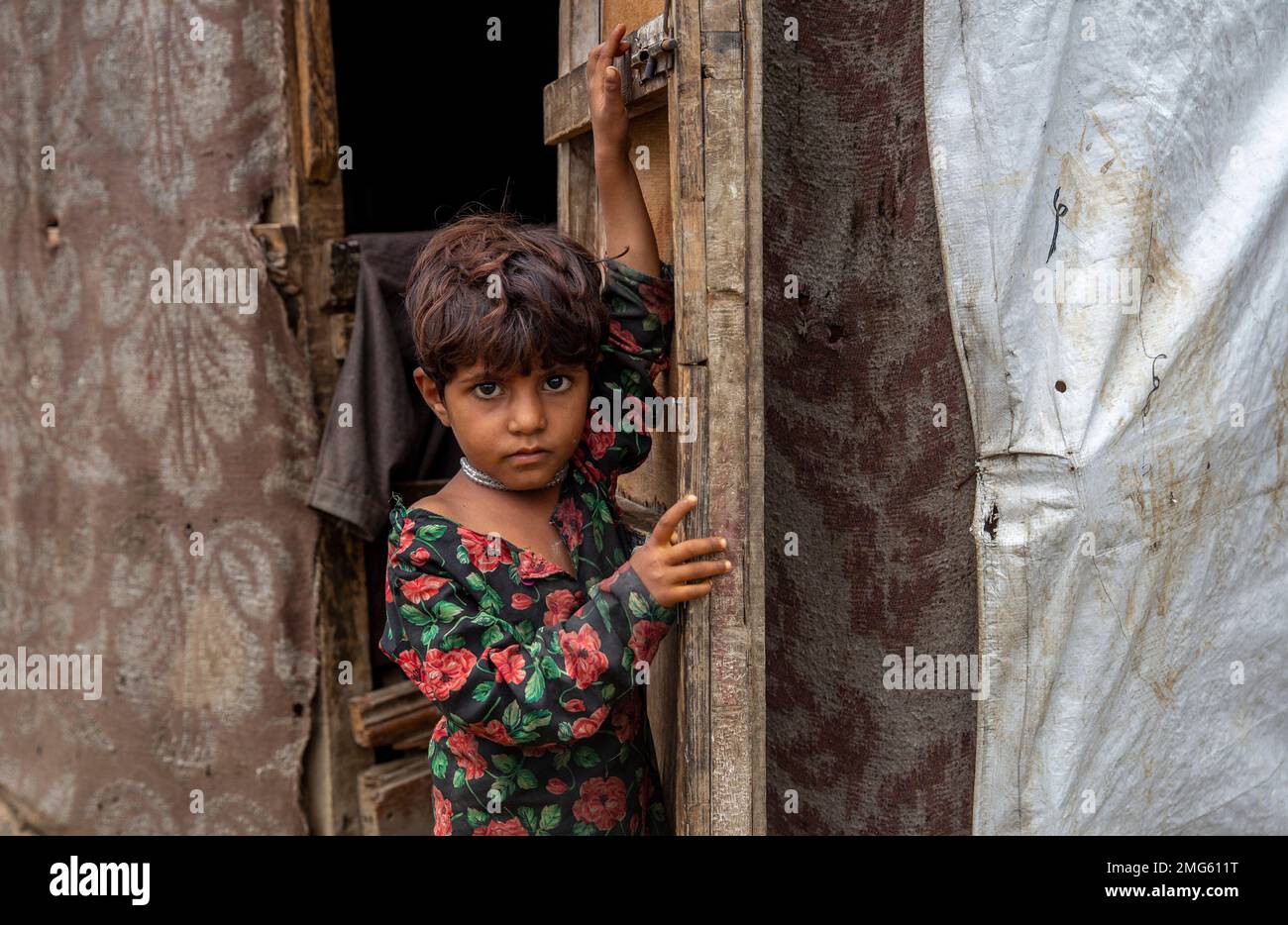Shaban Khan, a Bakarwal nomad girl, looks on as she stands outside her ...