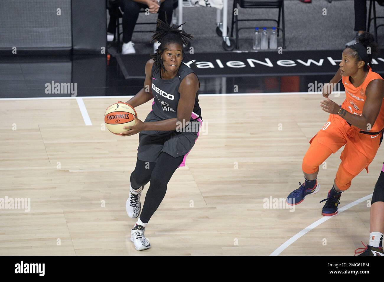 Washington Mystics guard Ariel Atkins sets up to pass the ball in front ...