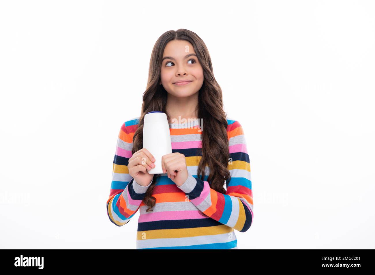 Child teen girl with shampoos conditioners and shower gel. Long hair ...