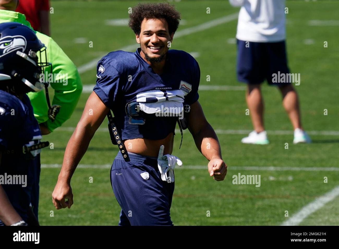 Seattle Seahawks running back Travis Homer smiles as he walks on the ...