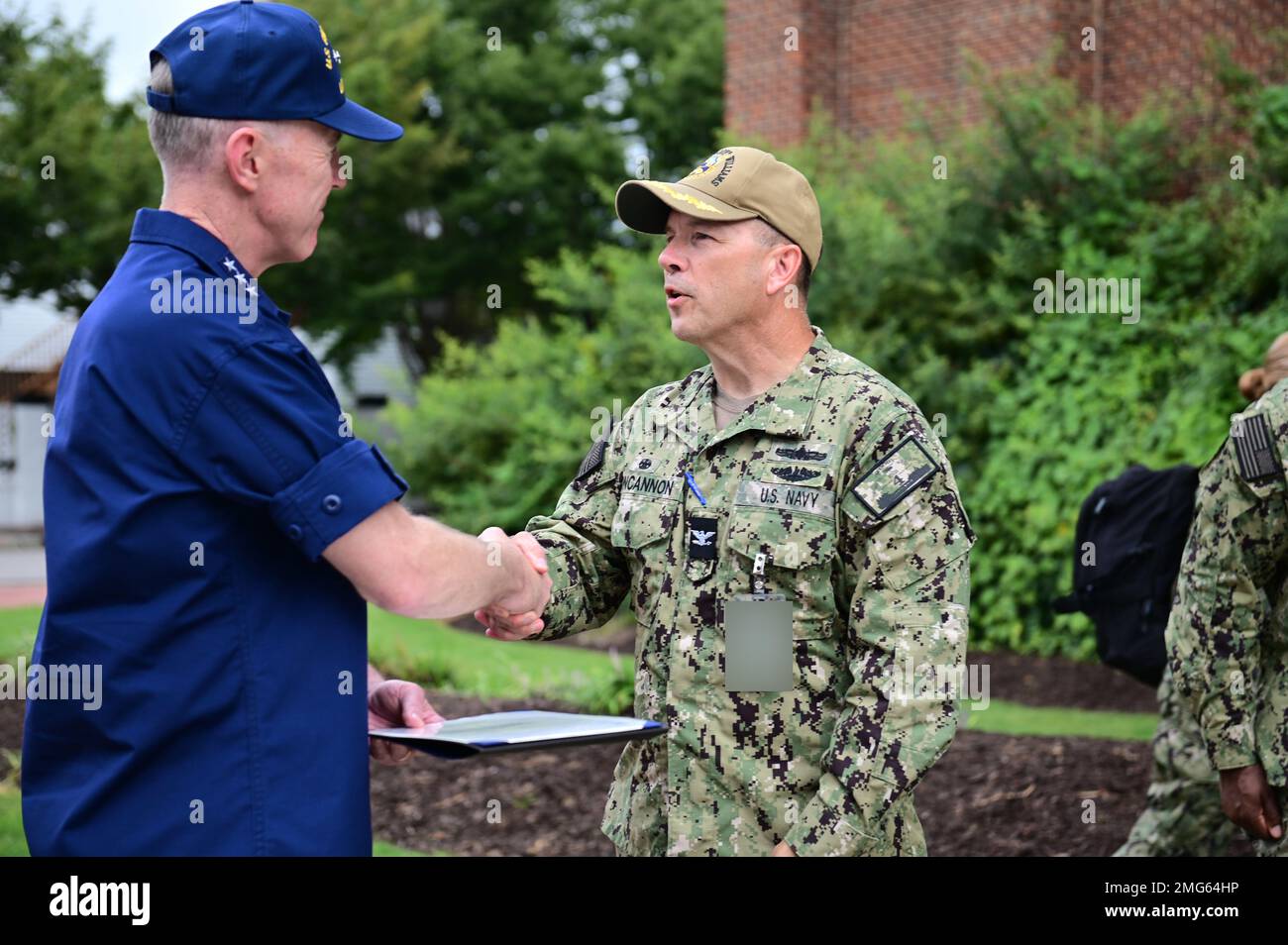Coast Guard Vice Adm. Kevin Lunday, Atlantic Area Commander, presents ...