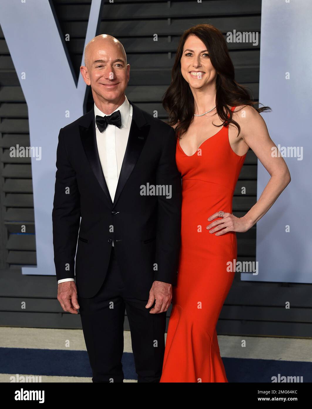 Jeff Bezos, left, and wife MacKenzie Bezos arrive at the Vanity Fair ...