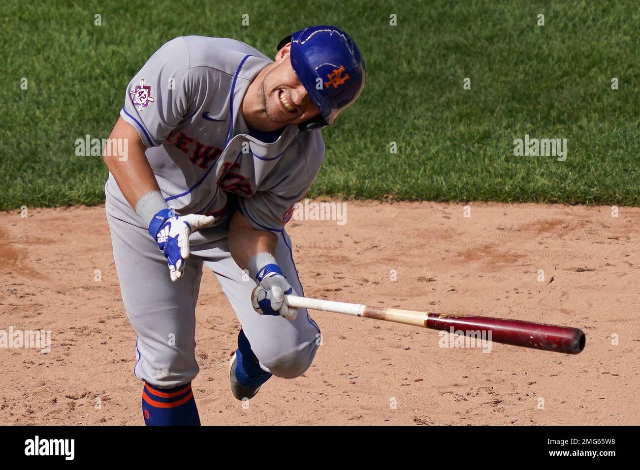 New York Mets' J.D. Davis reacts after being hit by a pitch from New ...
