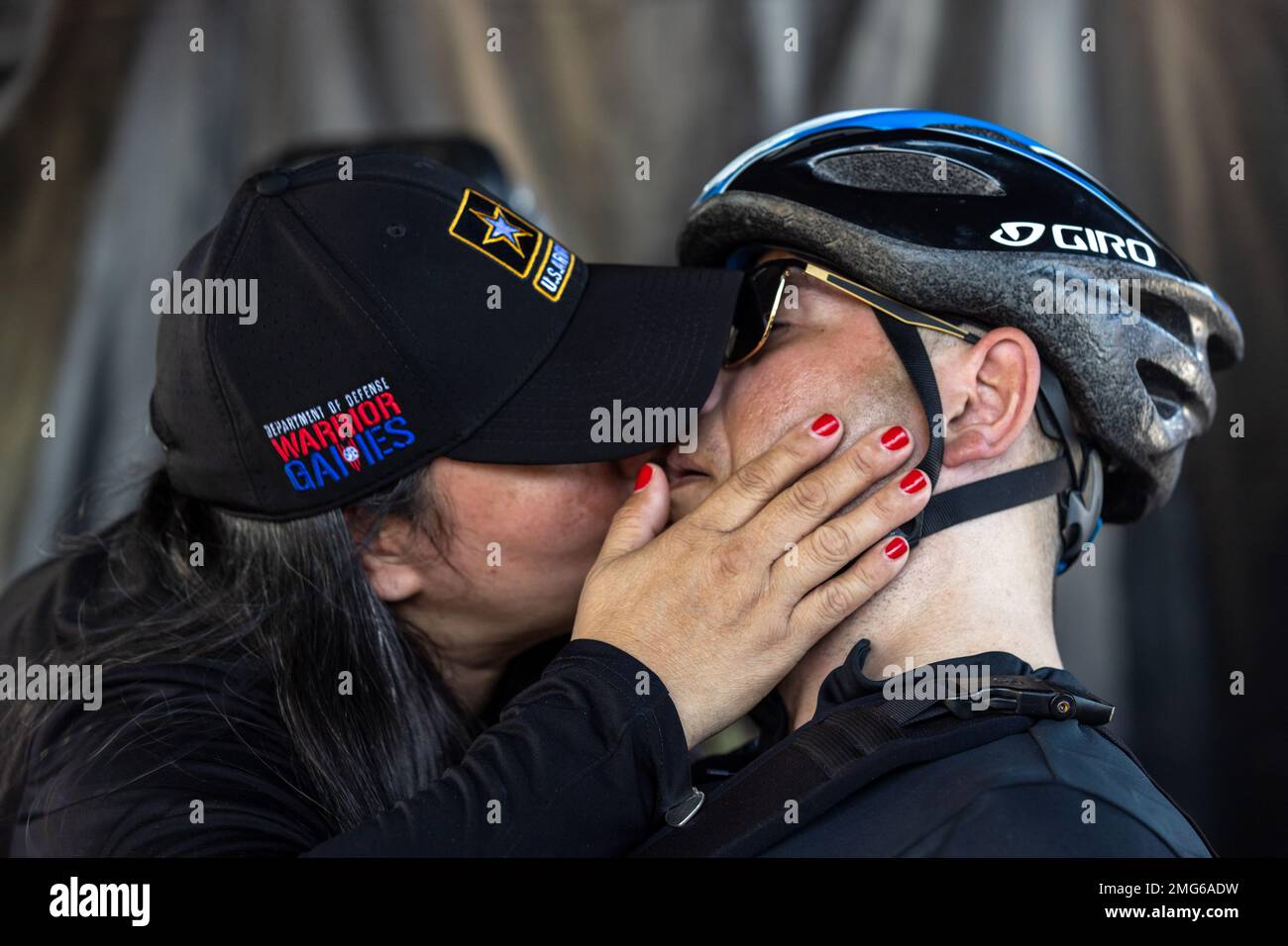 Claudia Avila kisses her husband U.S. Army Capt. Luis Avila at the ESPN ...