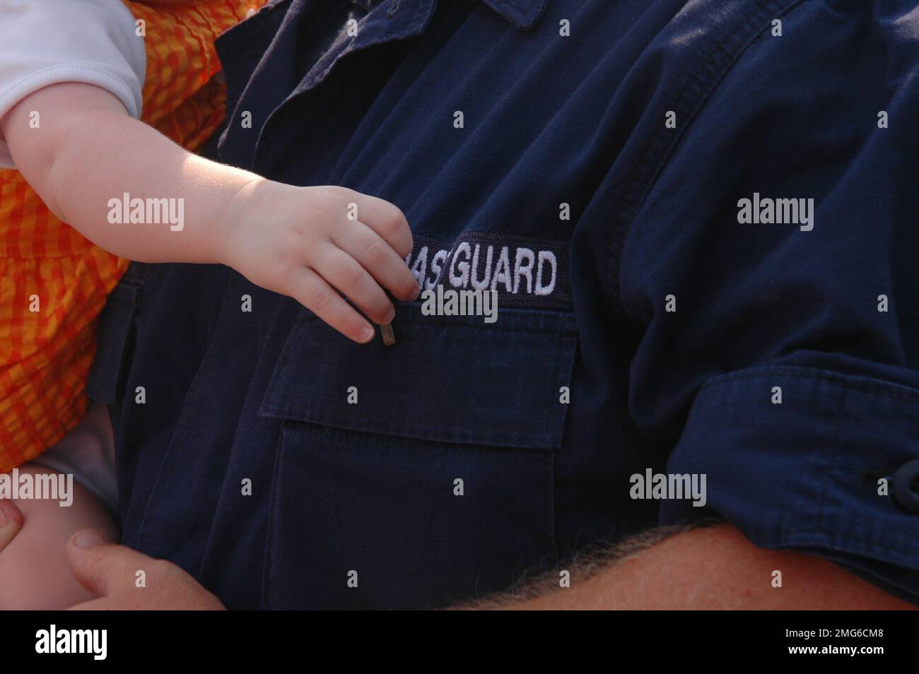 Coast Guard Personnel - Miscellaneous - 26-HK-90-351. toddler's hand on ...