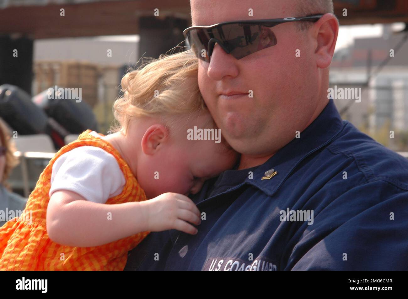Coast Guard Personnel - Miscellaneous - 26-HK-90-350. Toddler hugging ...