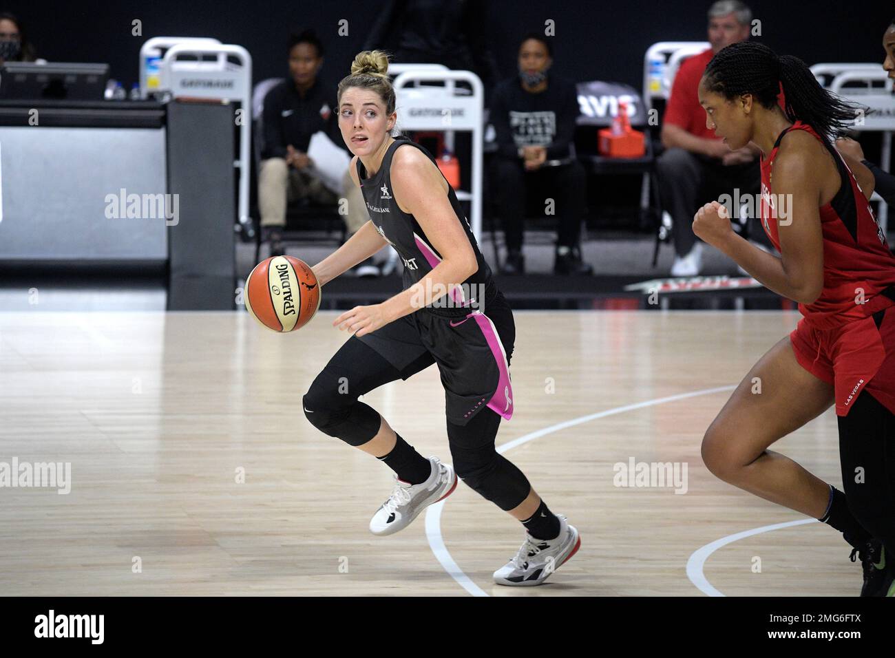 Dallas Wings guard Katie Lou Samuelson, left, pushes the ball up the ...