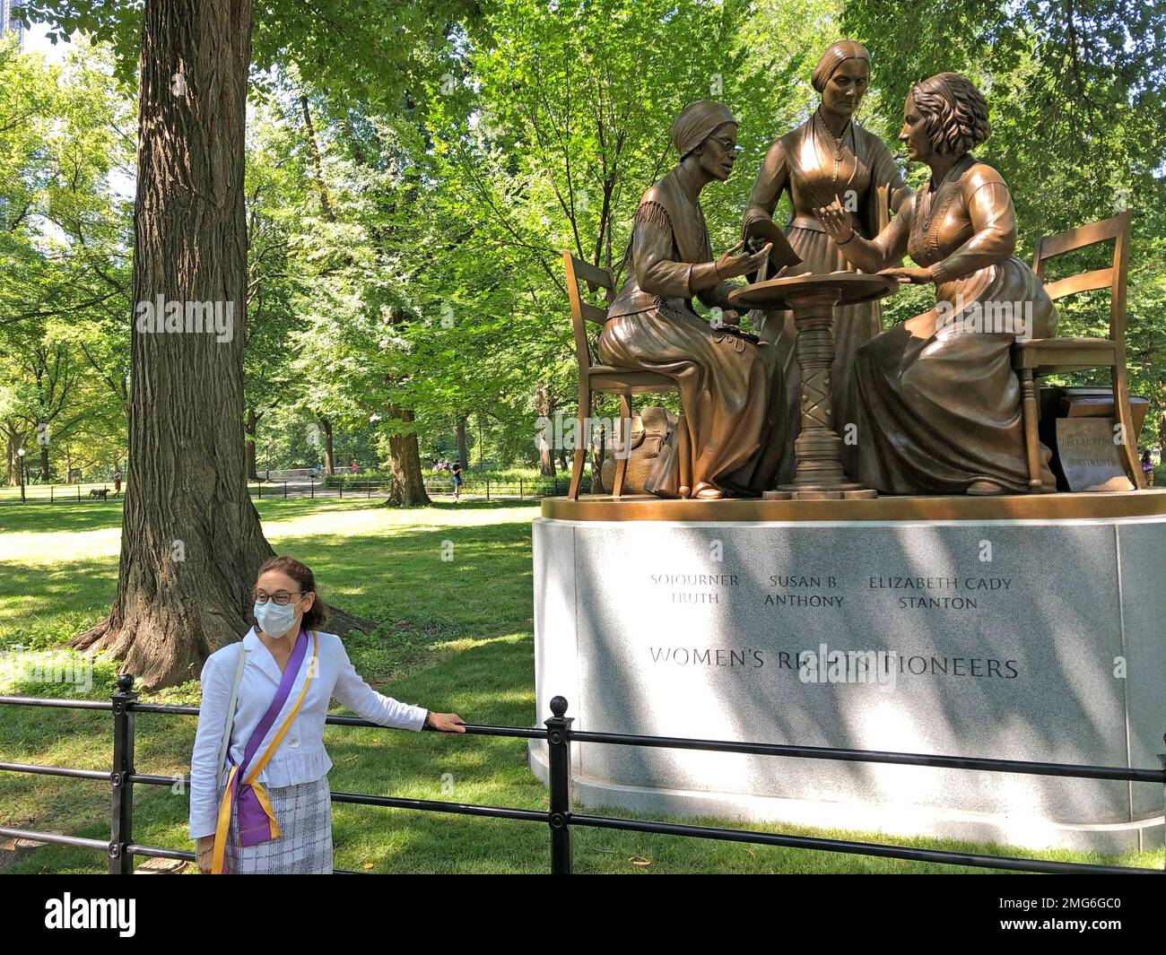 Sculptor Meredith Bergmann stand next to her statue honoring three ...
