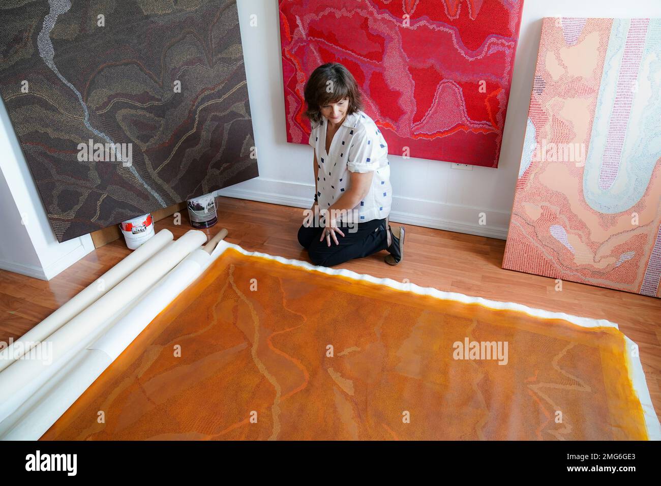 Brazilian artist Flavia Berindoague appears with her artwork in her ...
