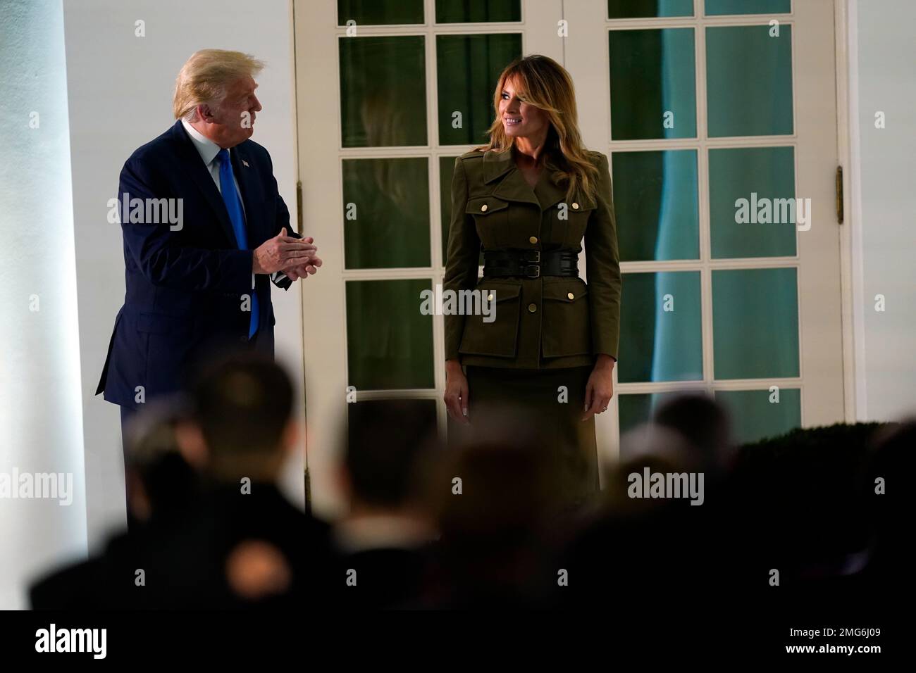 President Donald Trump joins first lady Melania Trump on stage after ...