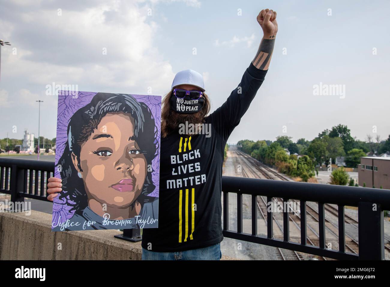 A protester poses for a photo during the Good Trouble Tuesday march for ...