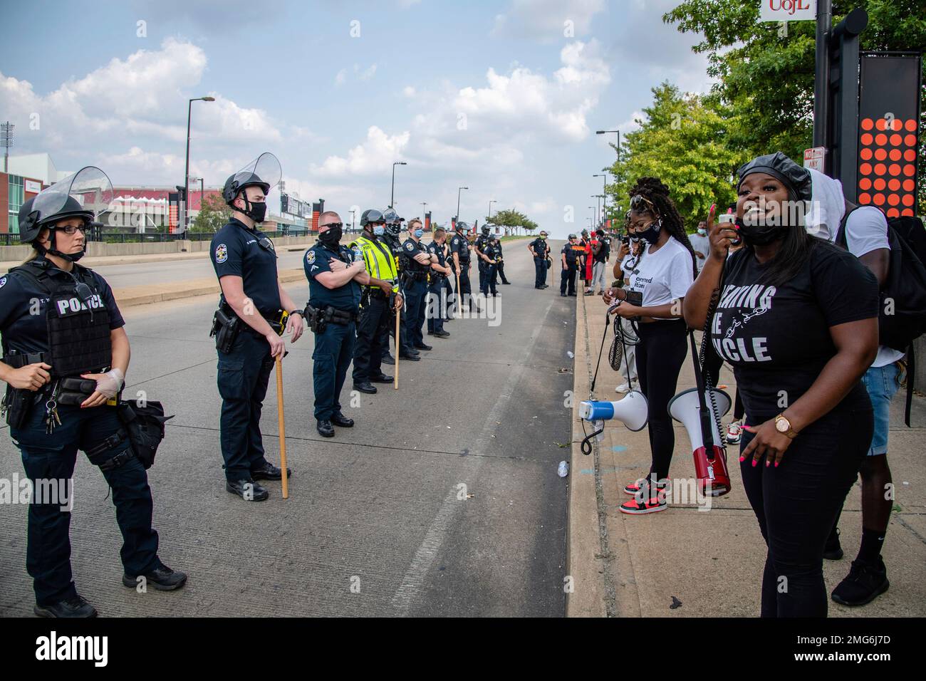 A protester speaks with police during the Good Trouble Tuesday march ...