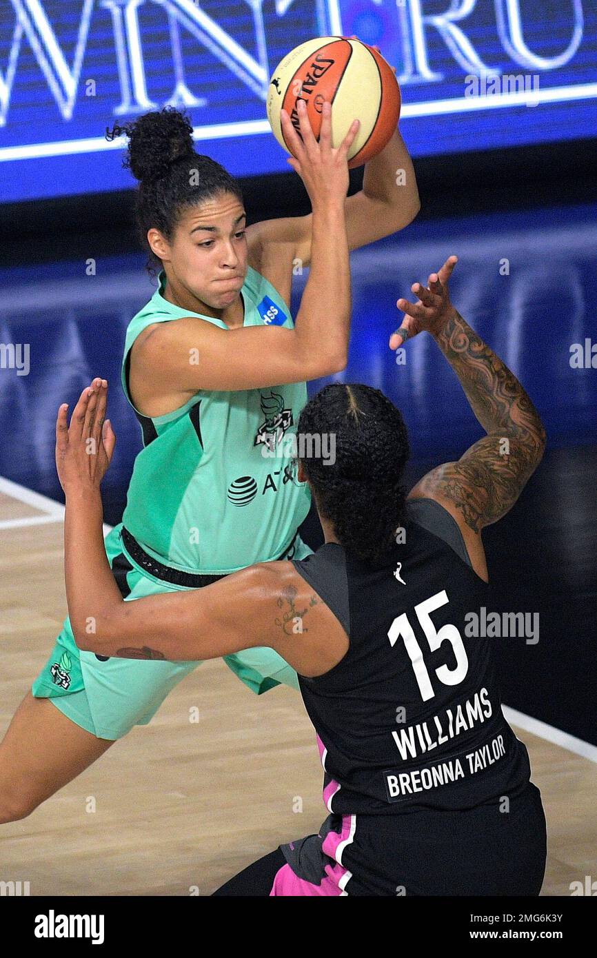 New York Liberty guard Kia Nurse drives to the basket in front of ...