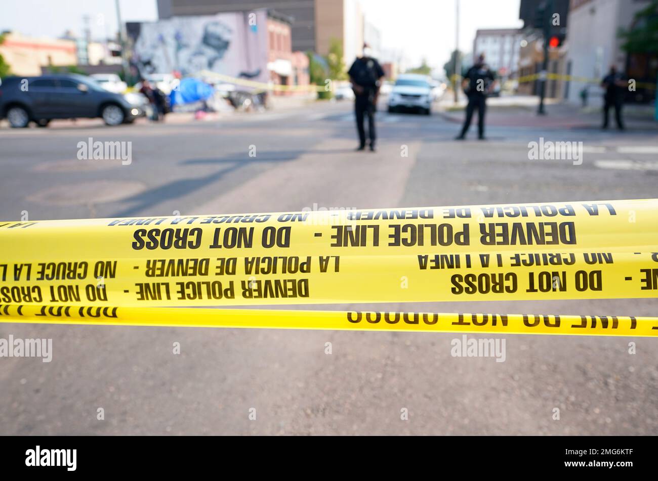 Caution tape blocks off the intersection of 22nd and Champa as Denver ...