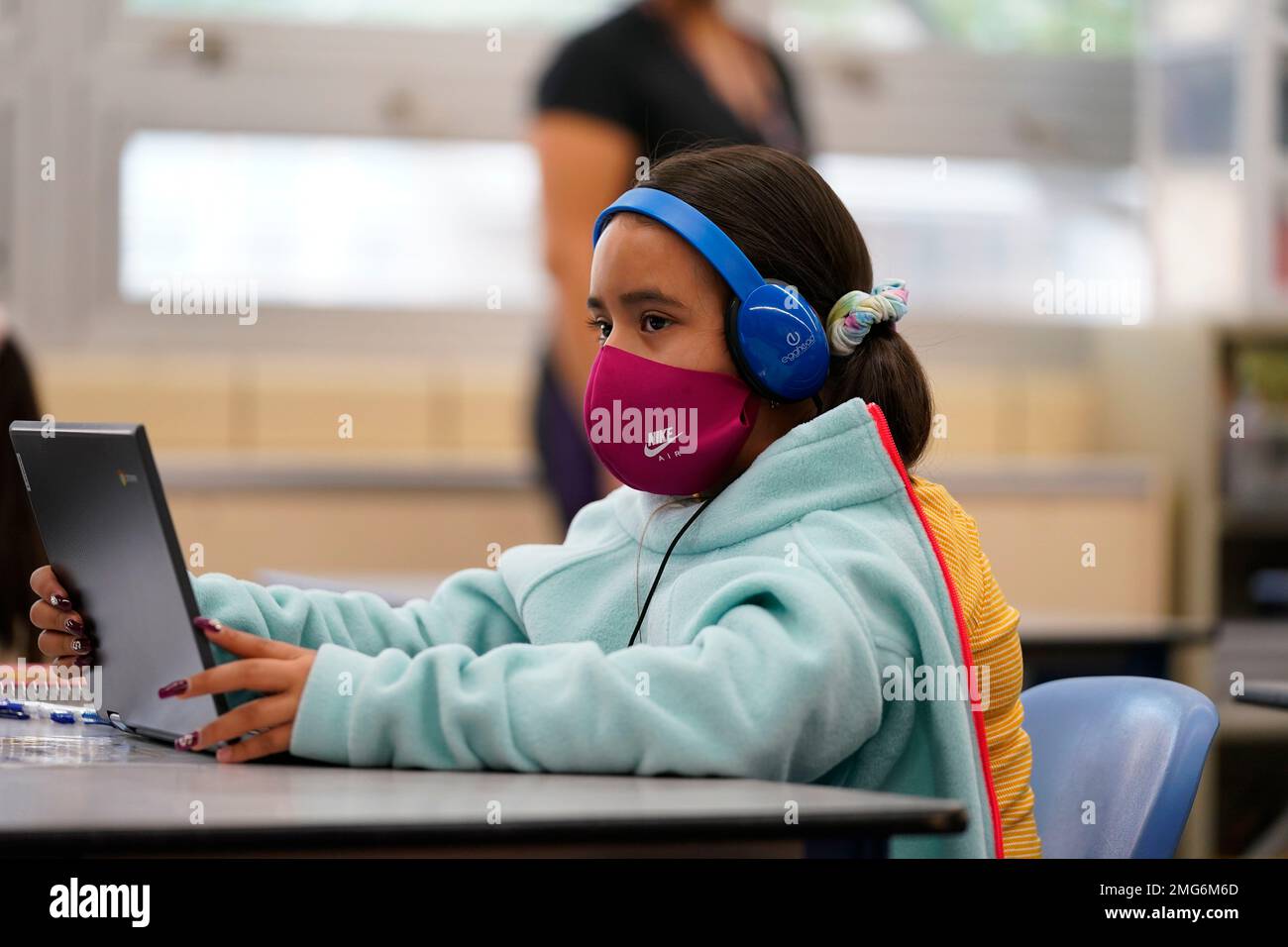 Reyna Najera works on a laptop in a classroom in Newlon Elementary ...