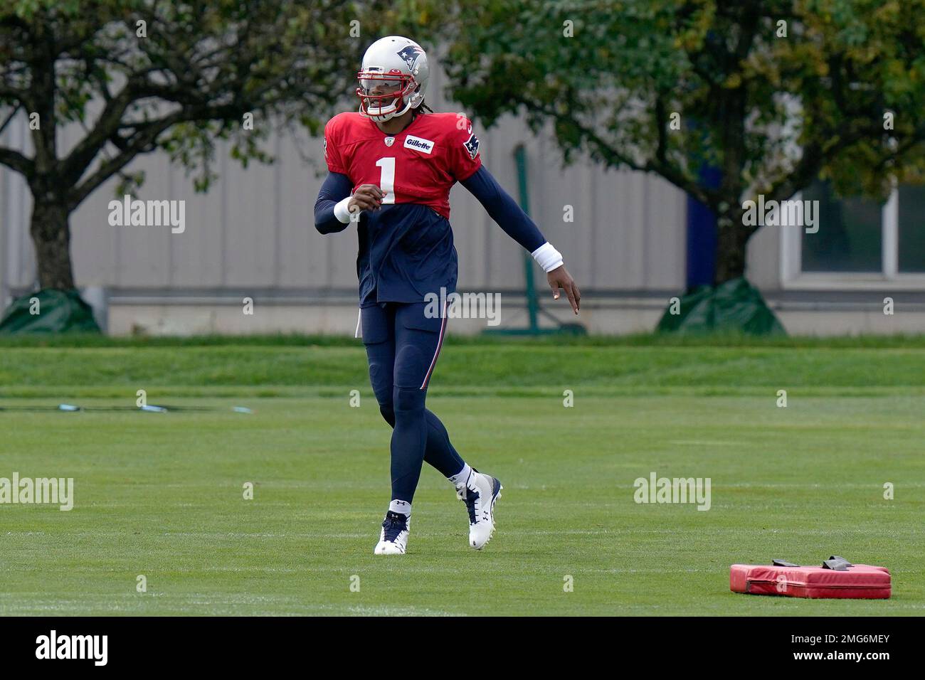 New England Patriots quarterback Cam Newton stretches during an NFL ...