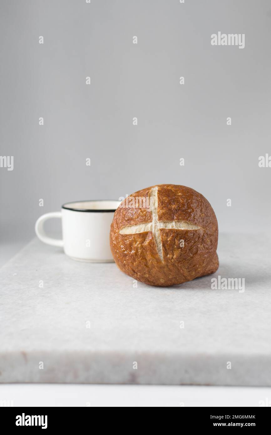 Top view of Pretzel buns on a marble tray, German laugenbroetchen on a ...