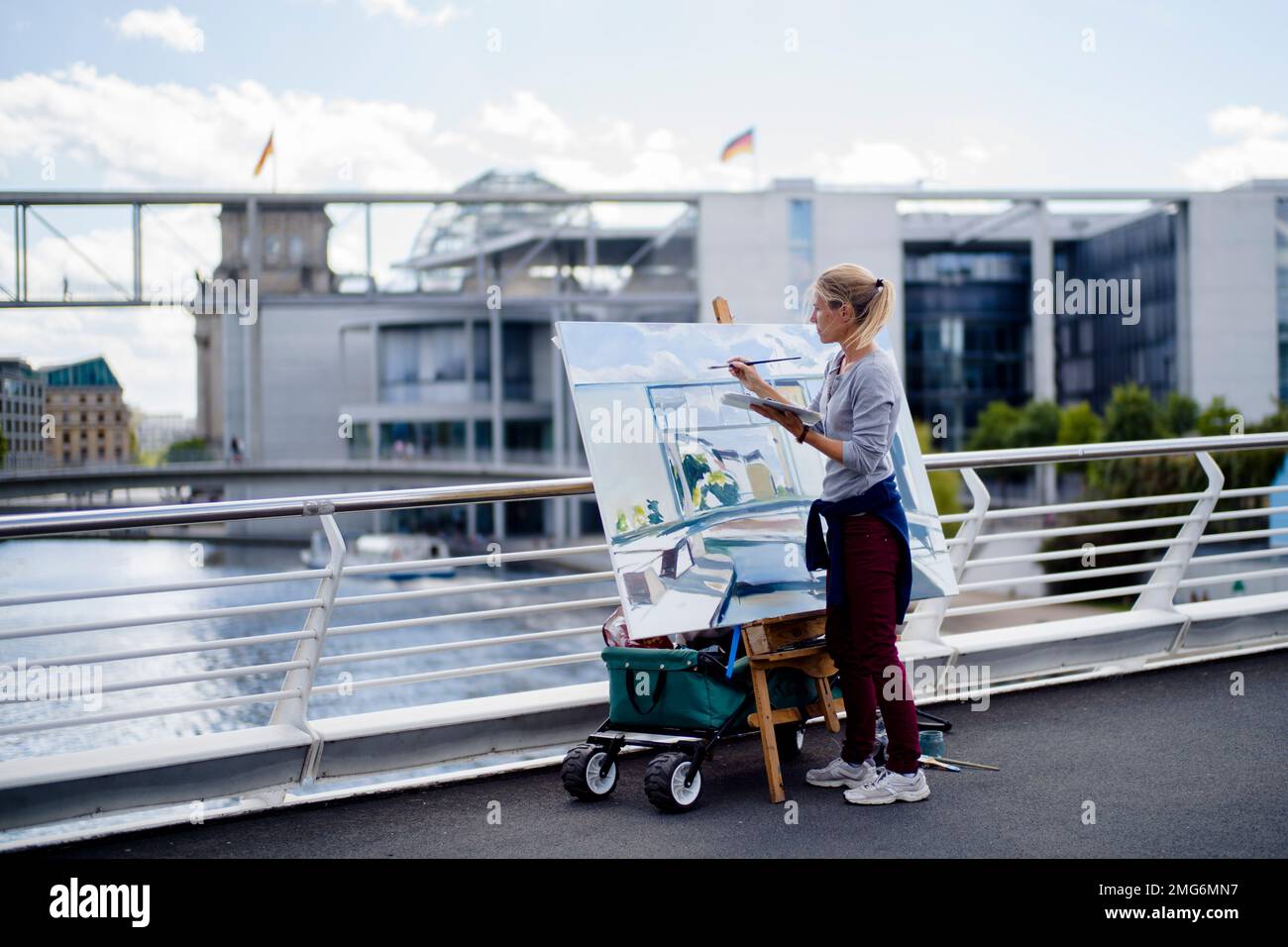 Artist Lisa Schoefer works on an oil painting of German parliament ...