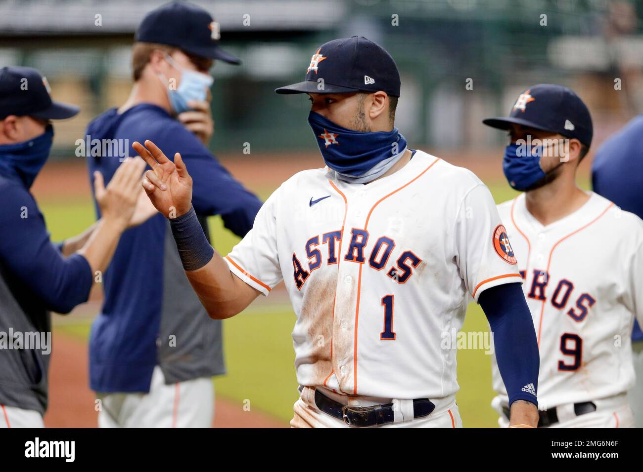 Houston Astros' Carlos Correa (1) and Jack Mayfield (9) celebrate non ...