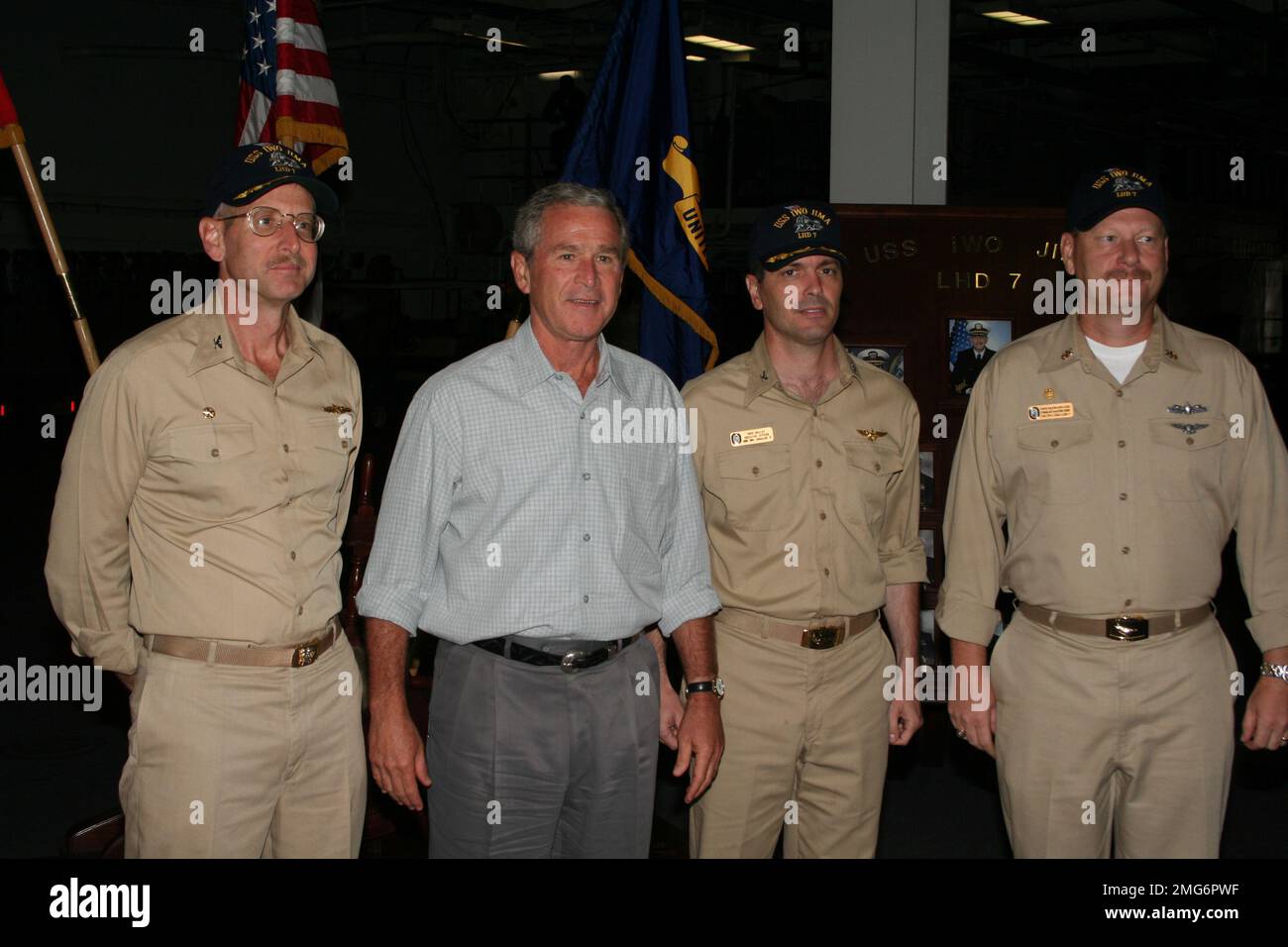 President George W. Bush Visit - 26-HK-6-258. POTUS indoors with three ...