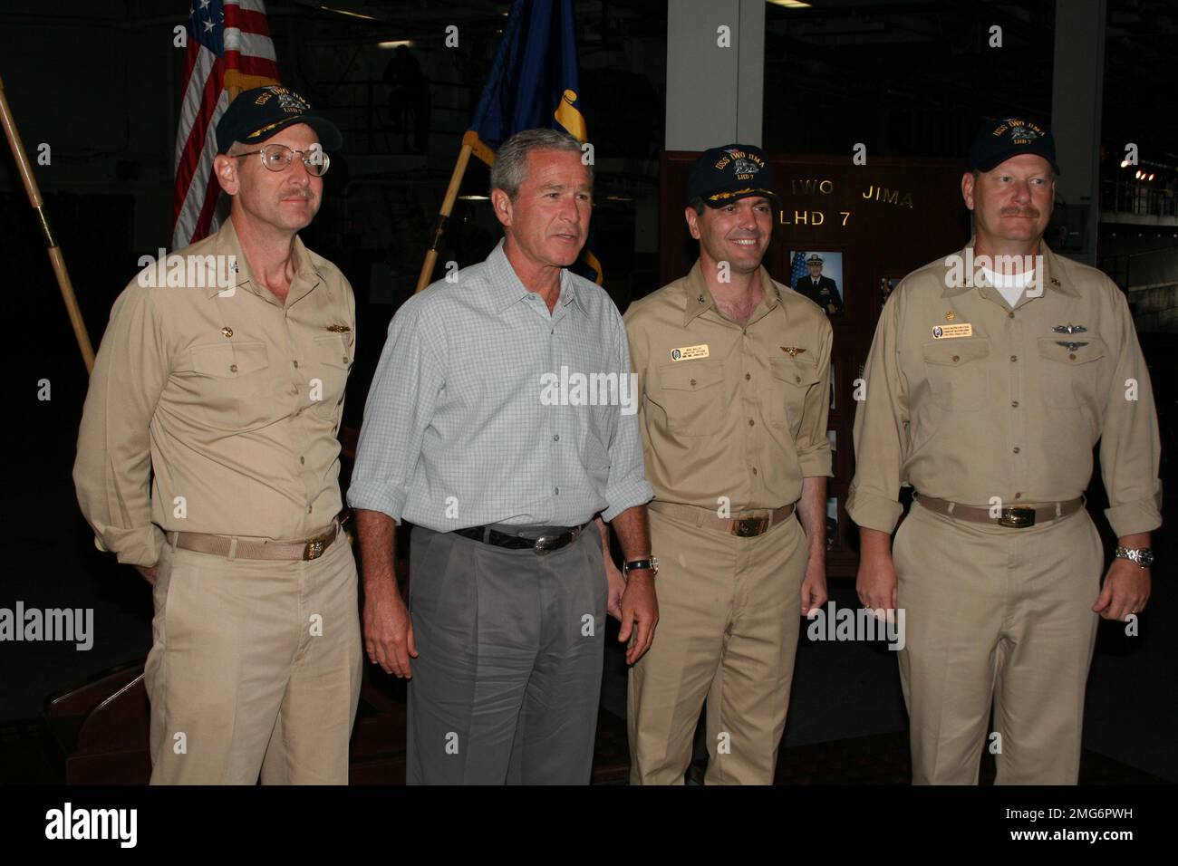 President George W. Bush Visit - 26-HK-6-259. POTUS indoors with three ...