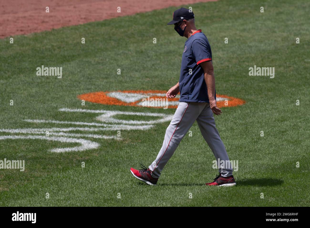 Boston Red Sox interim manager Ron Roenicke walks off the field after a ...