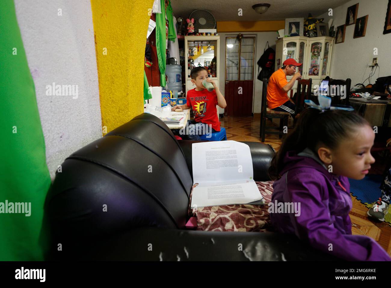 Liz, 5, watches a televised pre-kindergarten class in her family's home ...