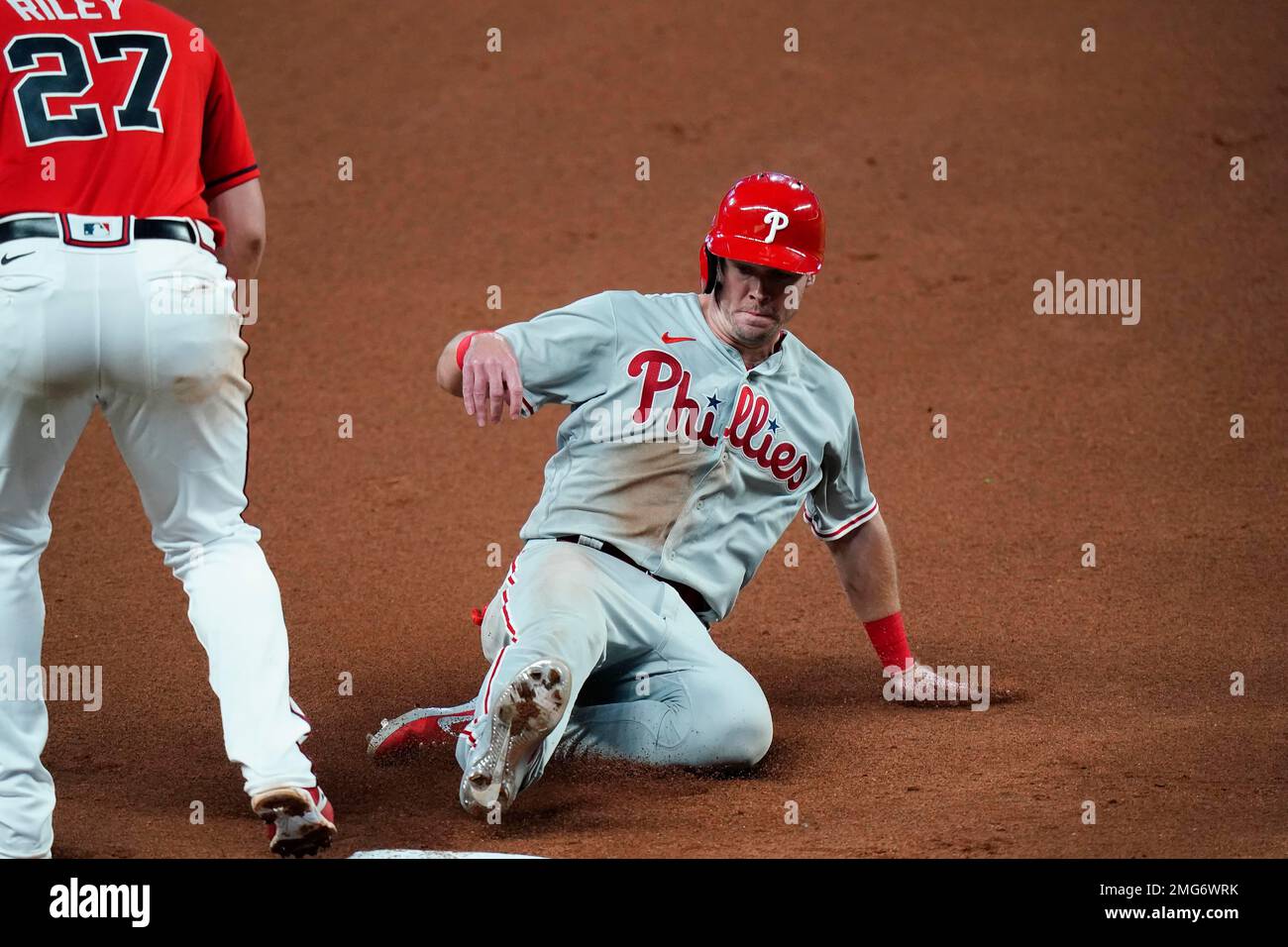 Philadelphia Phillies' Andrew Knapp, right, slides into second base ...