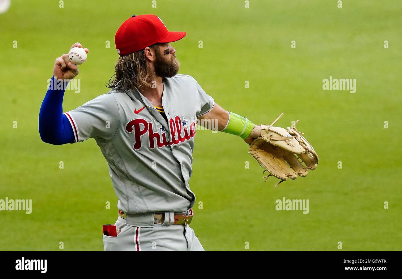 Philadelphia Phillies' Bryce Harper, center, passes a ball before a ...