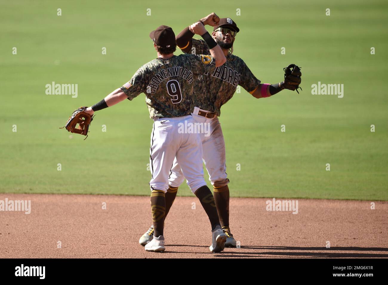 San Diego Padres' Jake Cronenworth, left, celebrates with Fernando ...