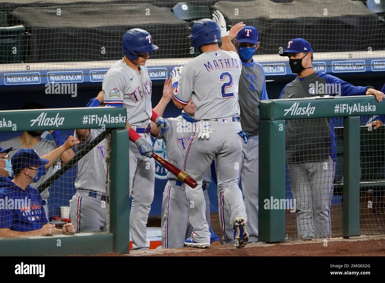 Texas Rangers' Jeff Mathis (2) is greeted in the dugout after hitting a ...