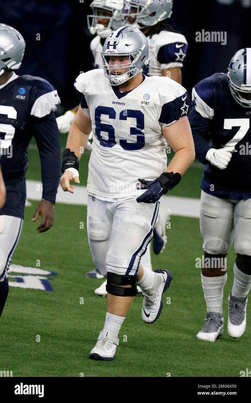 Dallas Cowboys center Tyler Biadasz (63) runs back to the line of ...