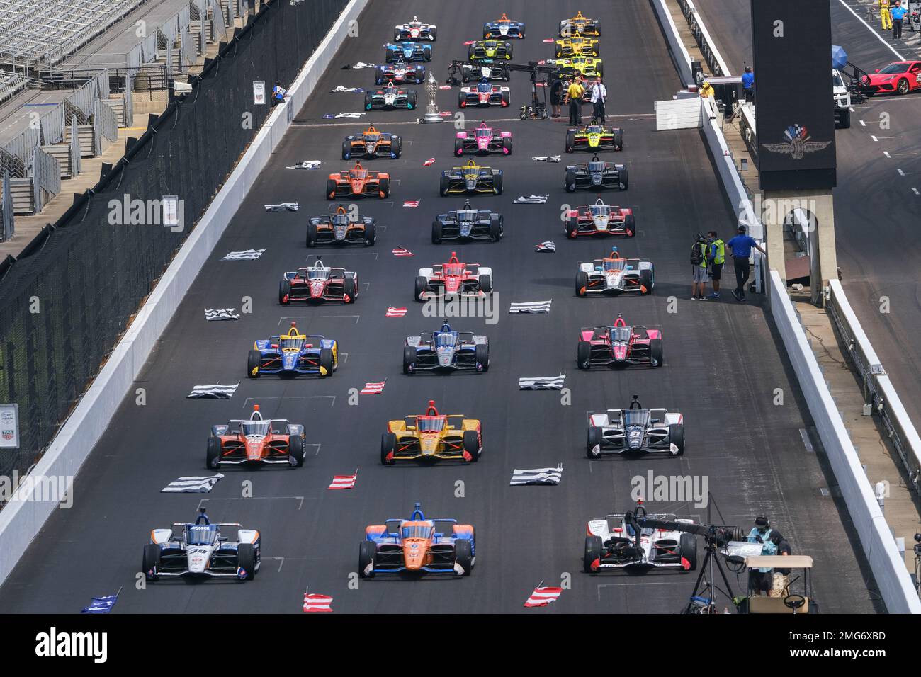 Cars are lined up on the starting grid ahead of the Indianapolis 500 ...