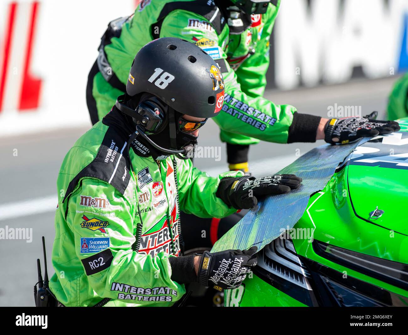 Kyle Busch's damage to his car is repaired during a NASCAR Cup Series ...