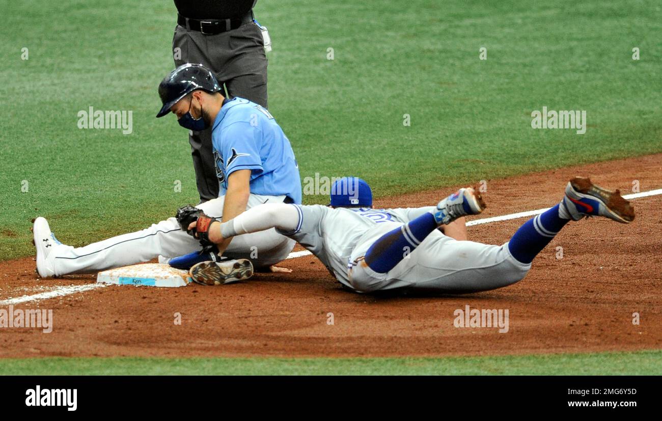 Tampa Bay Rays' Brandon Lowe, left, beats the tag from Toronto Blue Jays third baseman Brandon ...