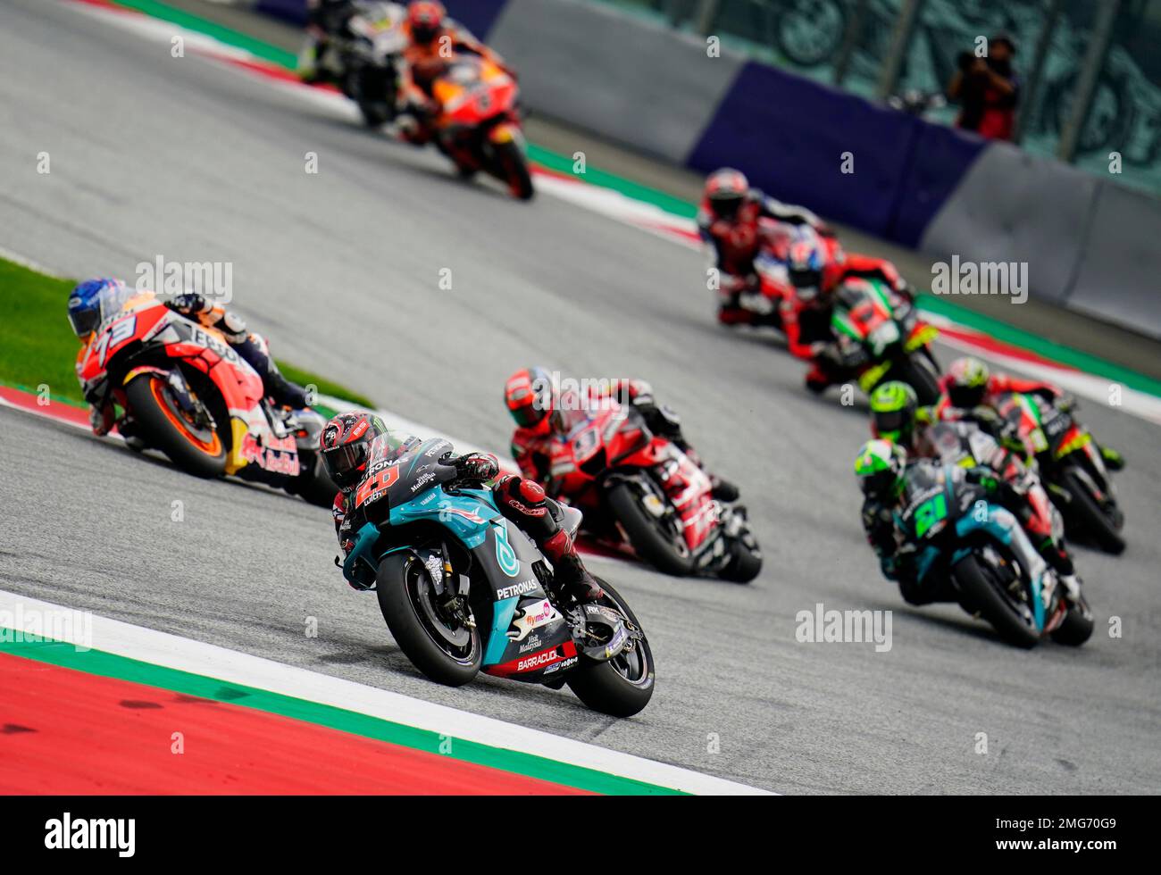 Drivers come around a curve during the MotoGP race at the Austrian ...