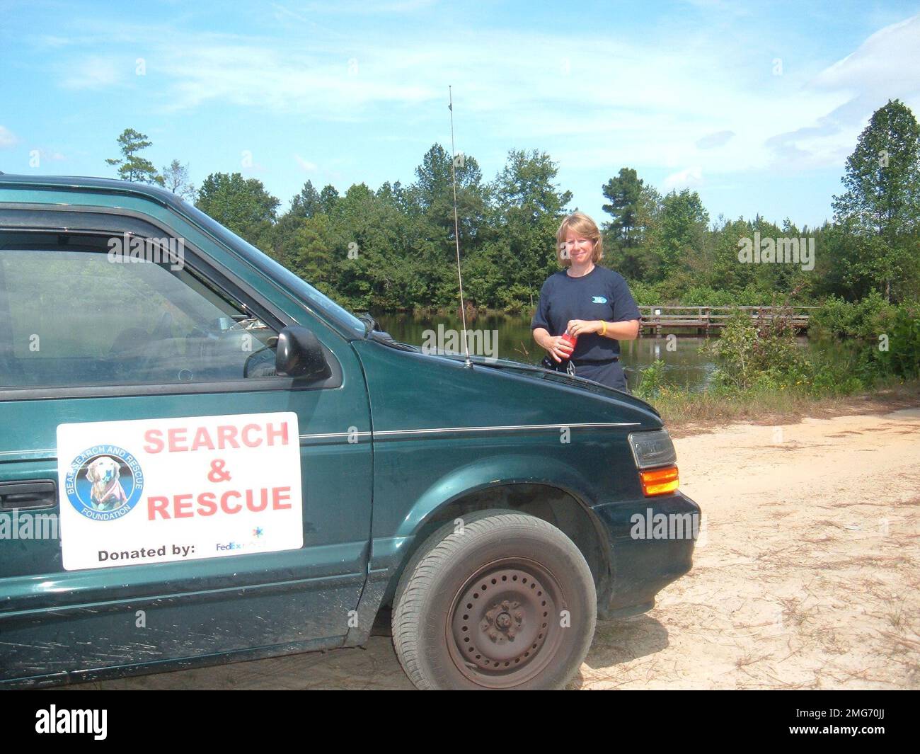 Animals - 26-HK-59-71. rescue personnel standing next to Search and ...